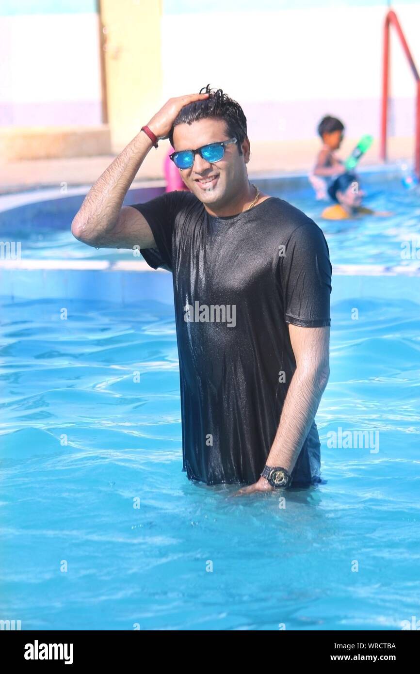 Man standing pool hi-res stock photography and images - Alamy