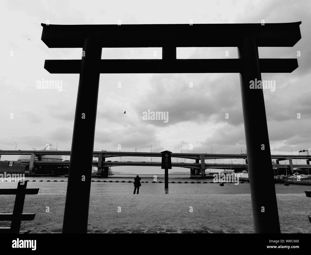 Low Angle View Of Torii Gate With Elevated Road In Background Stock ...