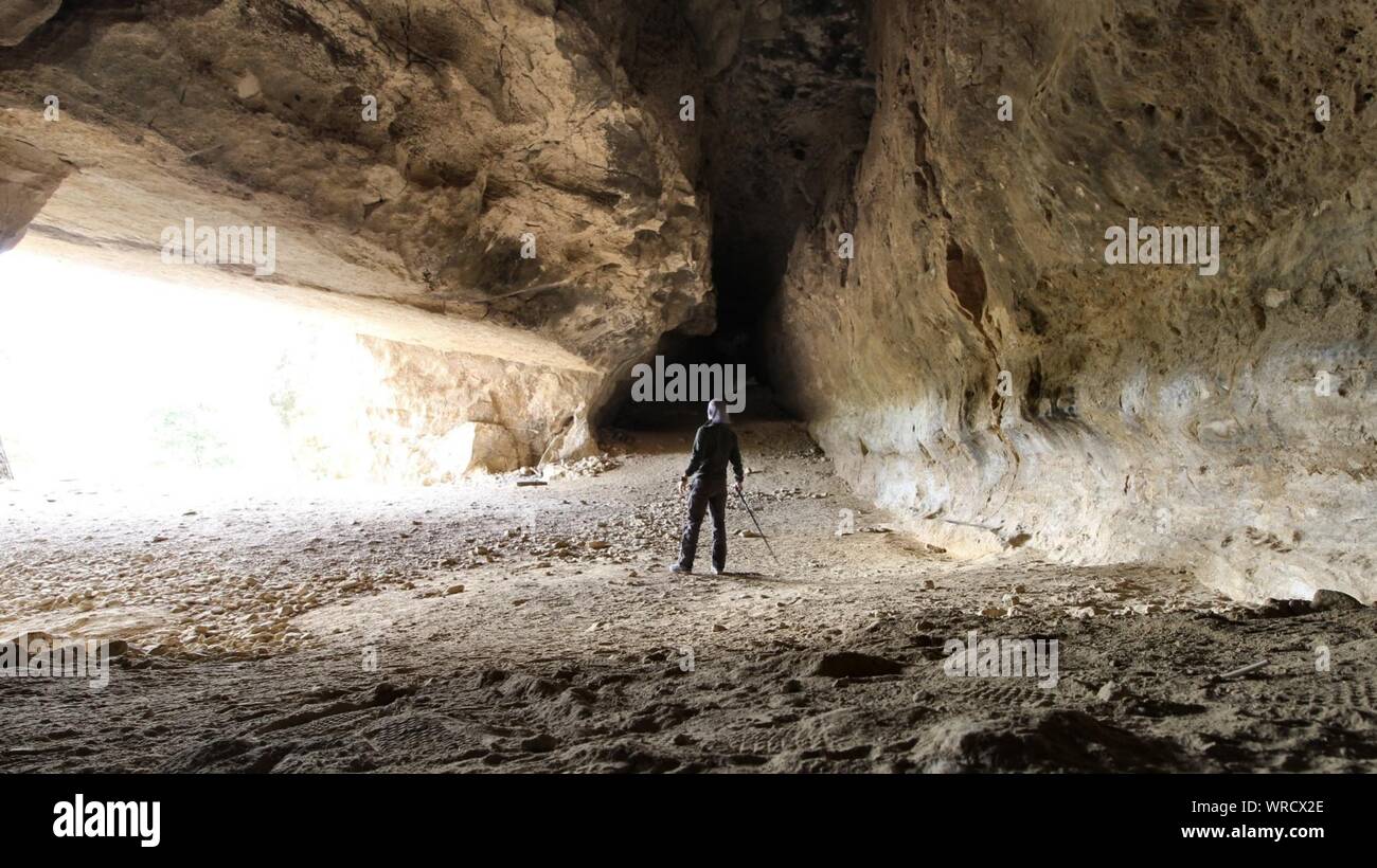 Man standing in cave hi-res stock photography and images - Alamy