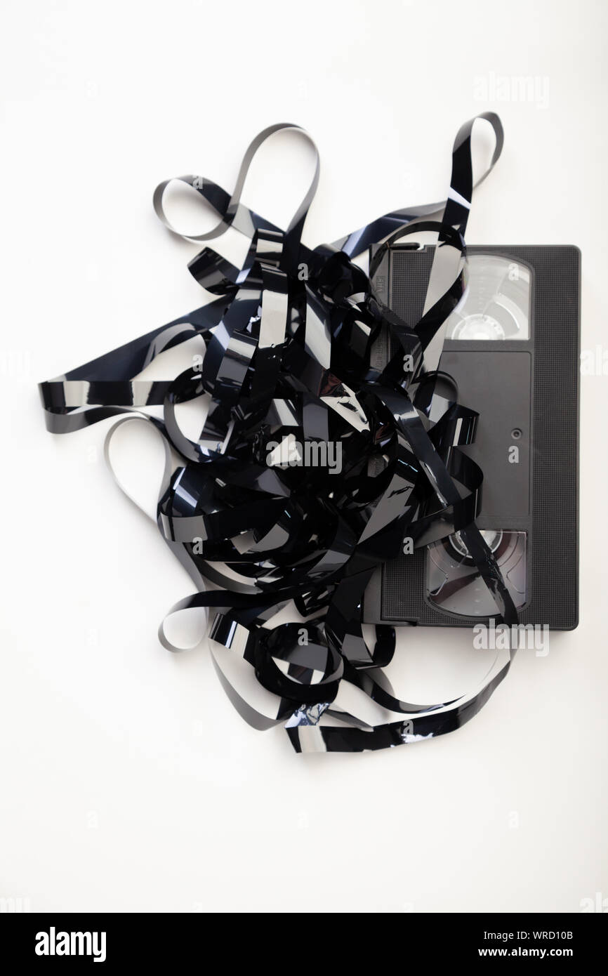 A videotape with it's magnetic tape pulled out Stock Photo - Alamy