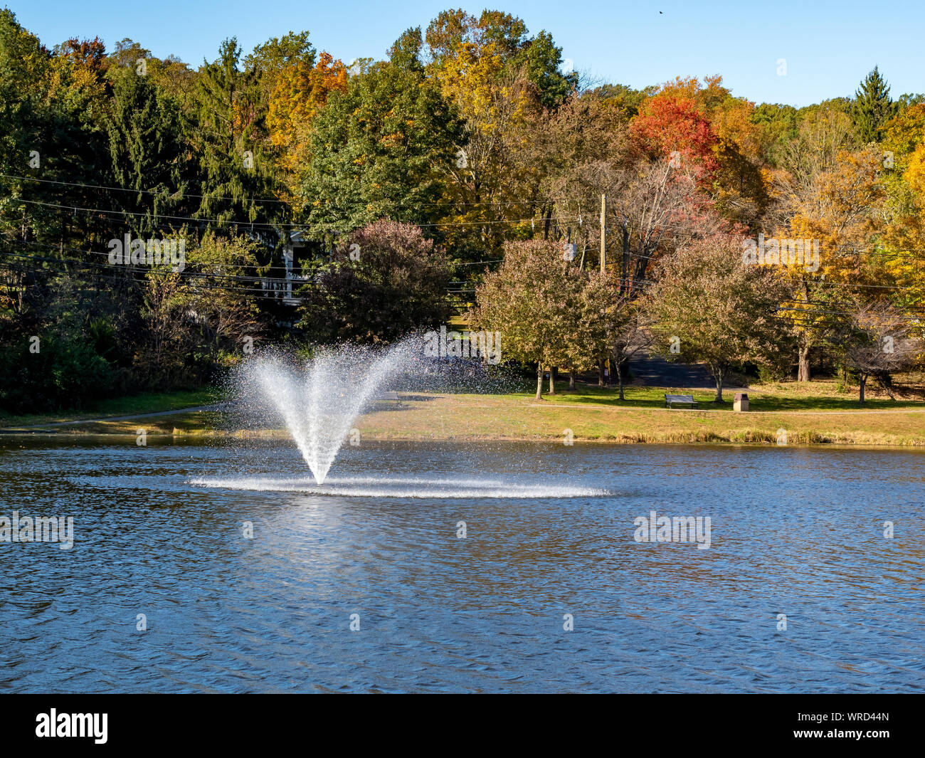 lake with water fountains in the fall Stock Photo - Alamy