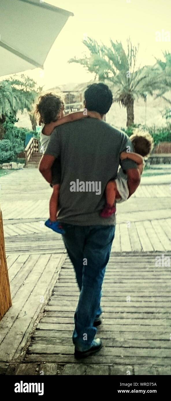 Carrying children hi-res stock photography and images - Alamy