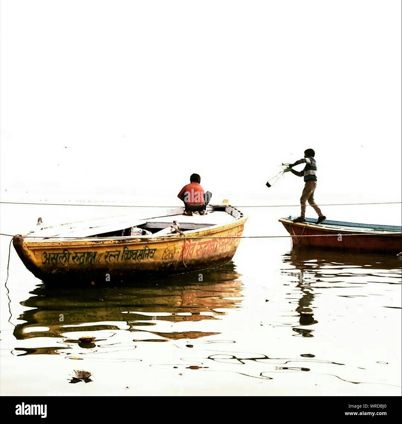 Boys on boat hi-res stock photography and images - Alamy