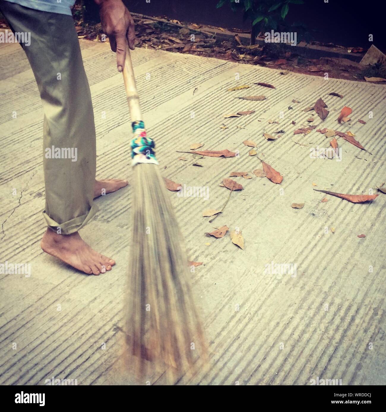 Man Sweeping Street High Resolution Stock Photography and Images - Alamy