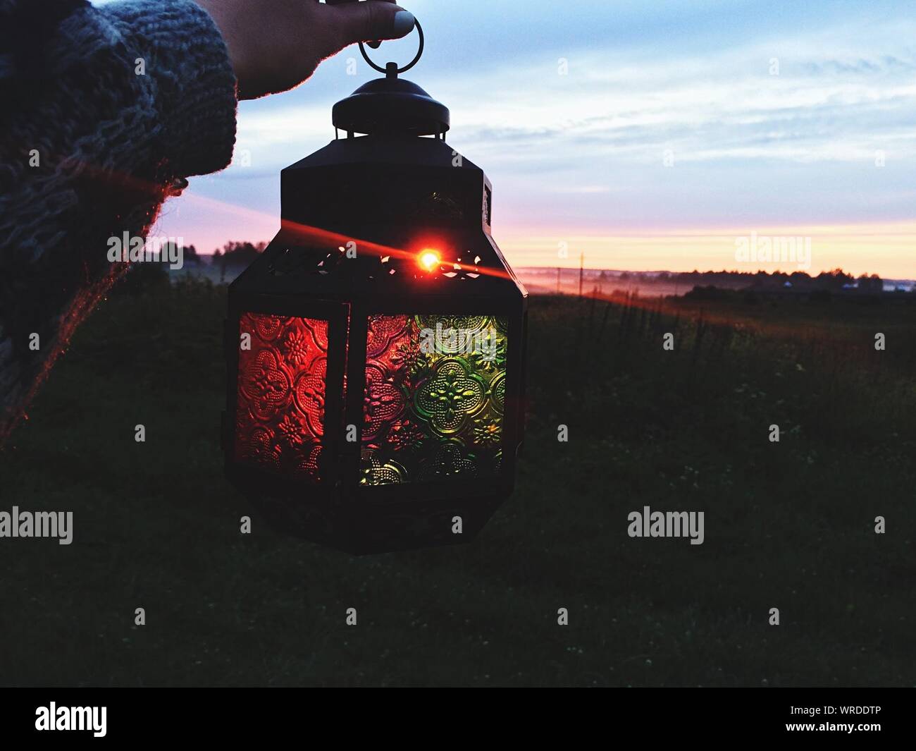 Hand holding lantern hi-res stock photography and images - Alamy