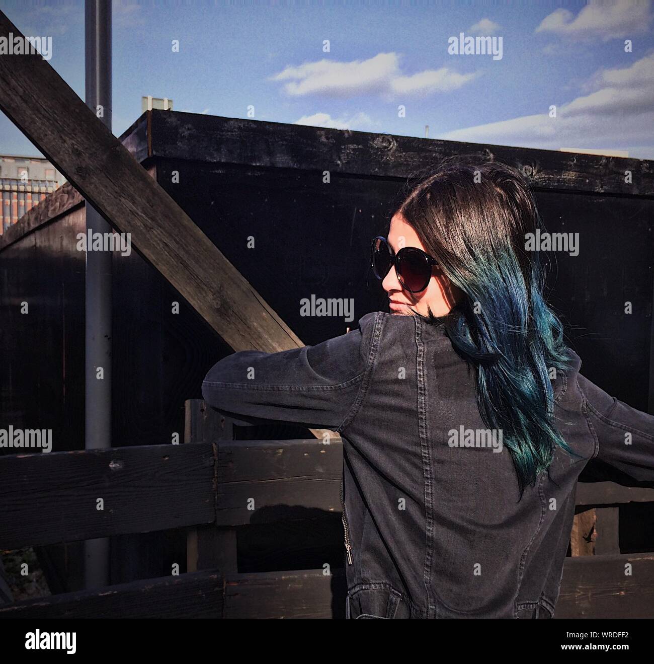 Leaning over fence hi-res stock photography and images - Alamy