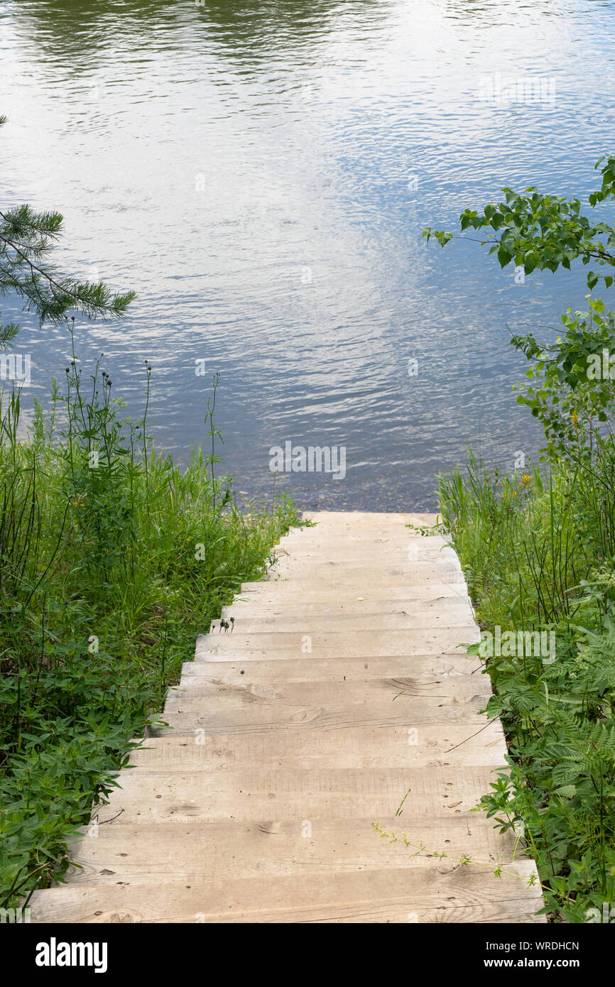 staircase or stairs into the water with wooden steps. Descent to the ...