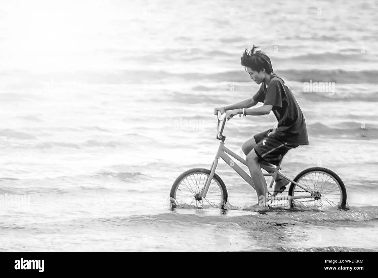 Full length boy side view Black and White Stock Photos & Images - Alamy