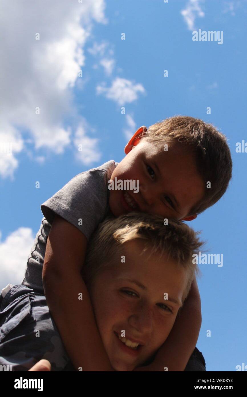 Boy carrying shoulders boy hi-res stock photography and images - Alamy