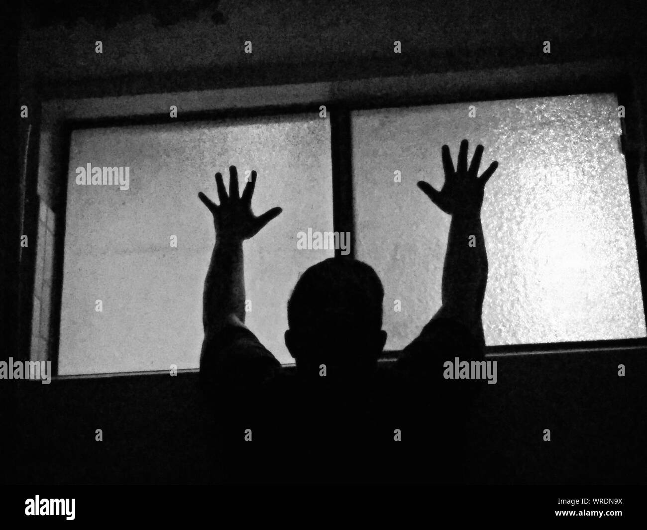 Man touching window Black and White Stock Photos & Images - Alamy