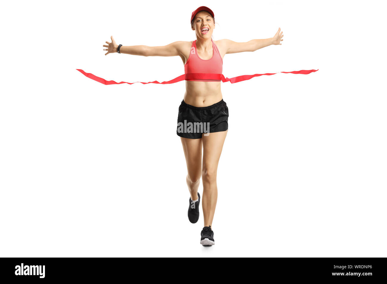 Full length portrait of a young smiling woman in sportswear running and ...