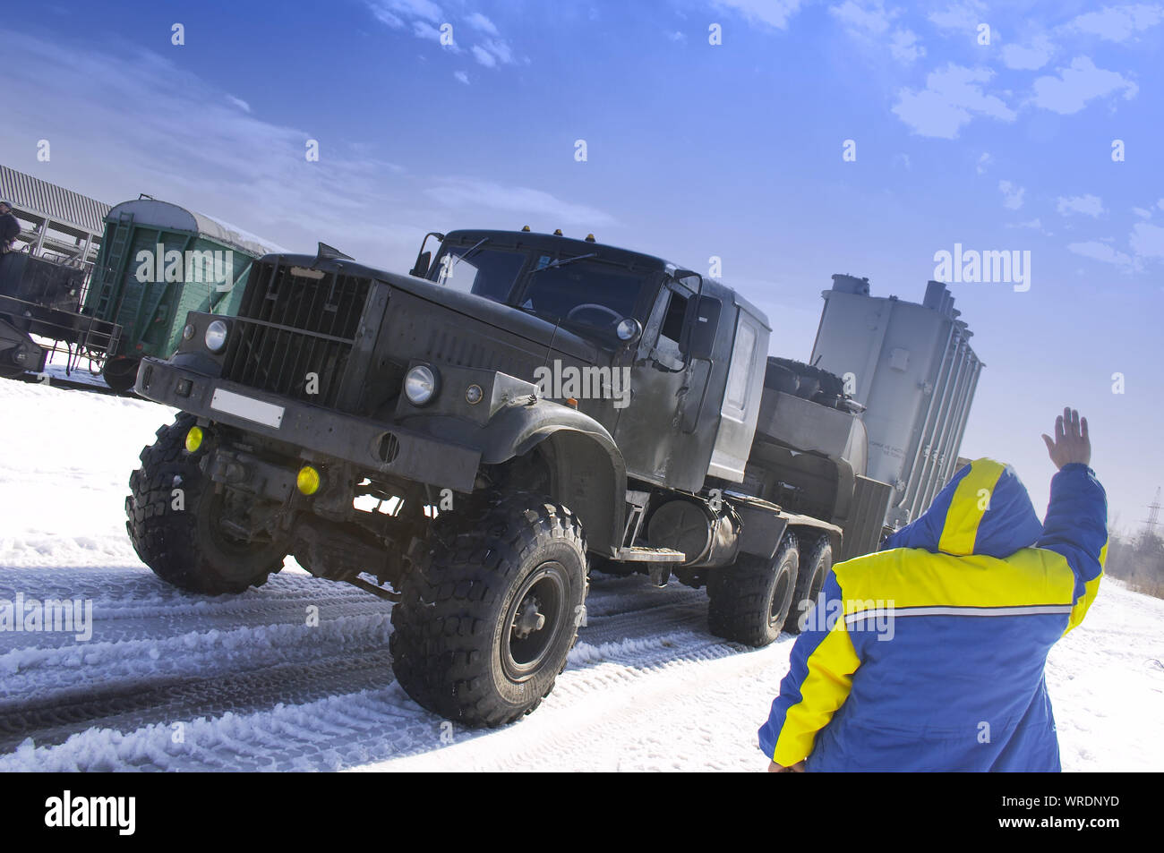 Loading of the big truck by a heavy cargo Stock Photo - Alamy