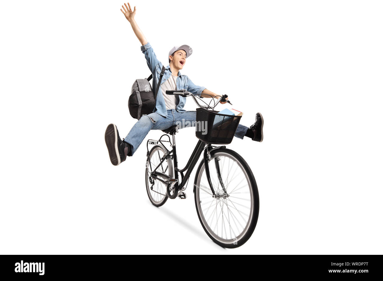 Energetic young male with a backpack riding a bicycle and gesturing ...