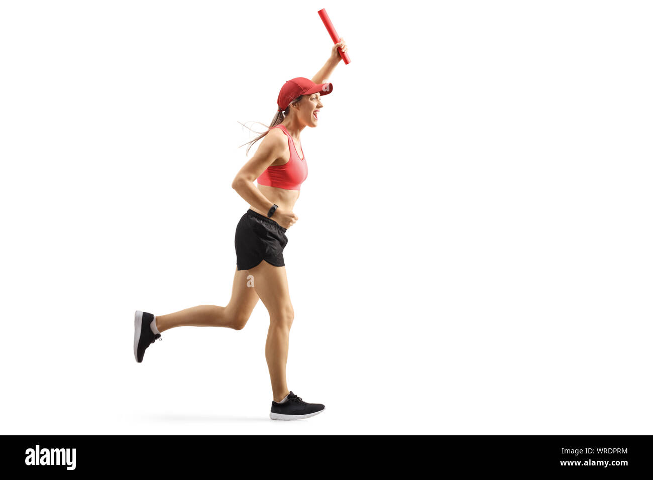 Full length profile shot of a young female runner on a relay race ...