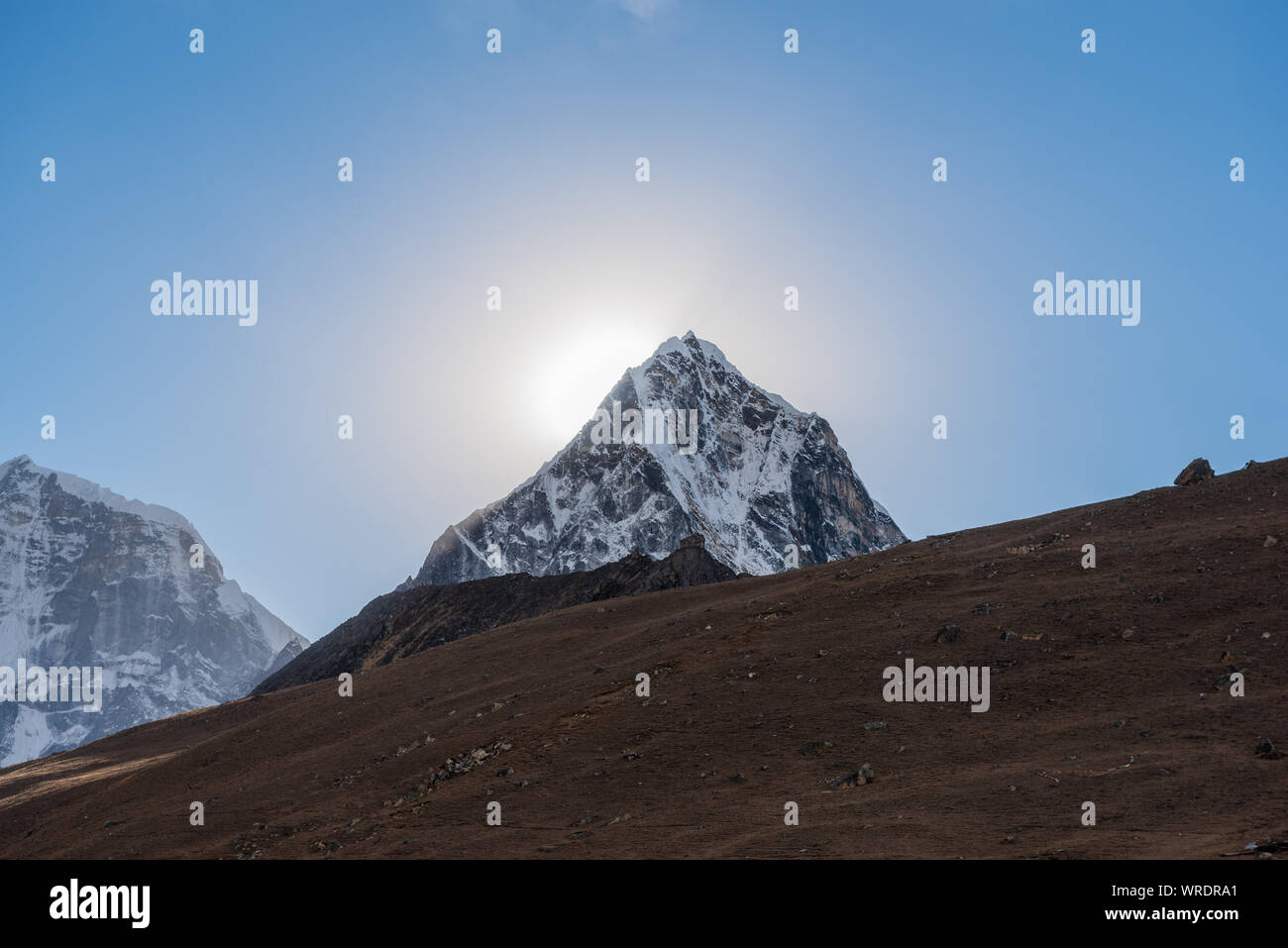 Halo over mountain peak in Himalayan mountains of Nepal Stock Photo - Alamy