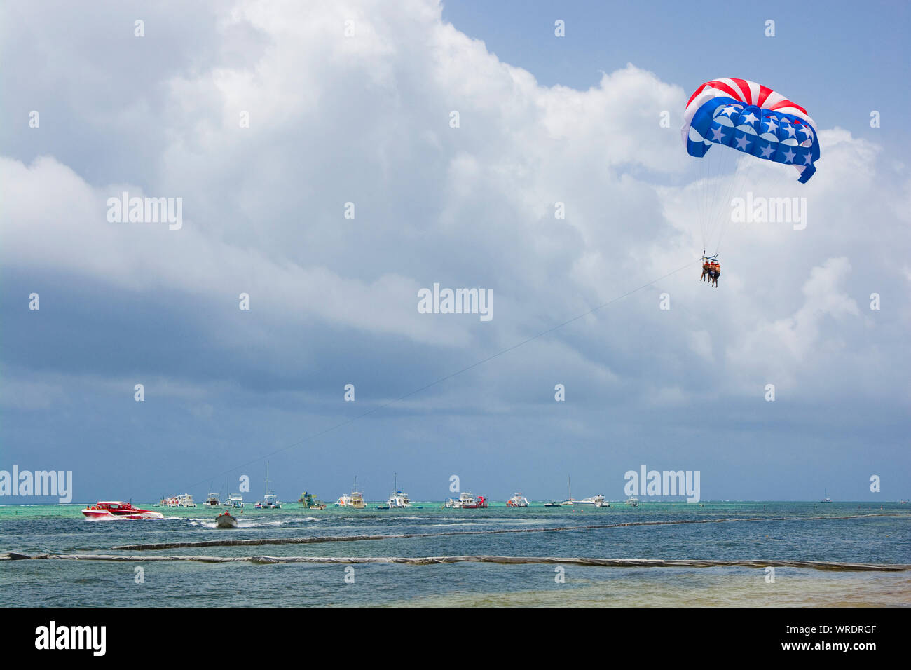 American flag colors parasail wing flying over turquoise water of ...