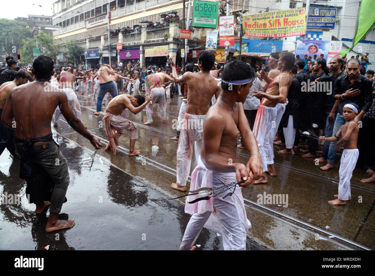 Kolkata, India. 10th Sep, 2019. Shiite Muslim men flagellate during the ...
