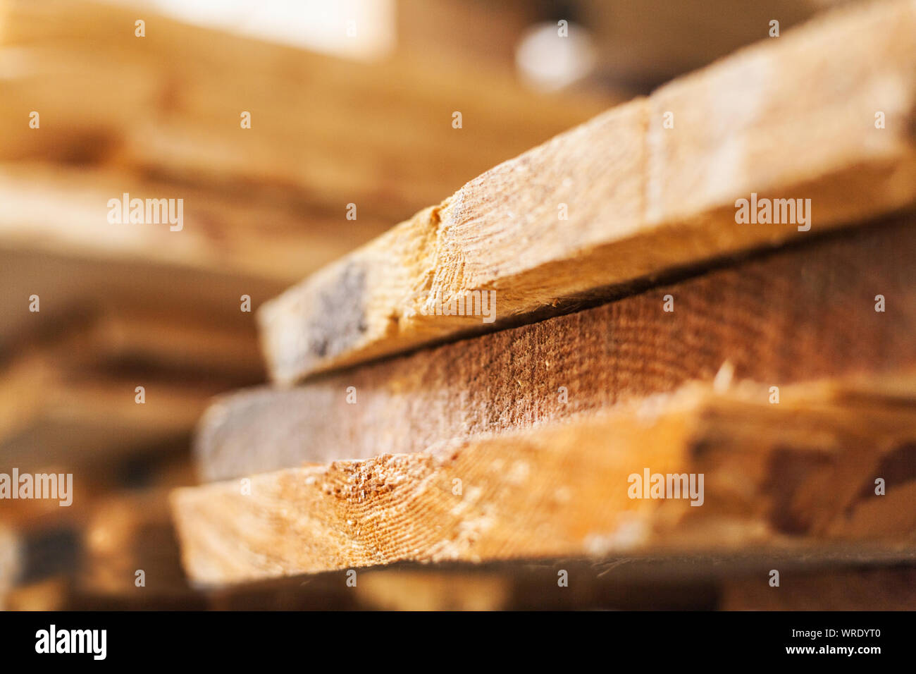 Stack of wood with wooden boards for further processing in wood ...