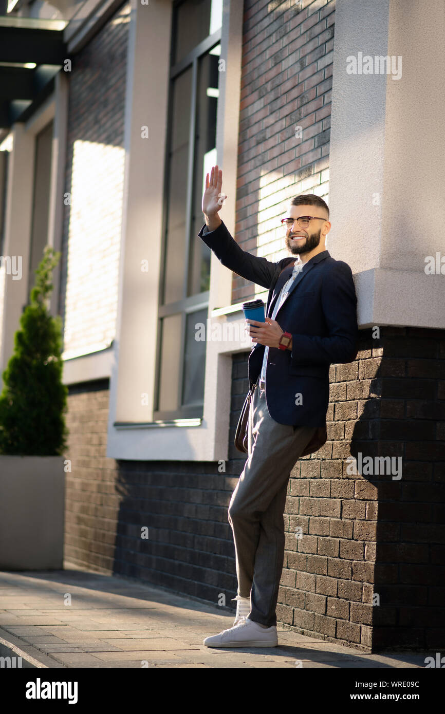 Worker waving hi-res stock photography and images - Alamy