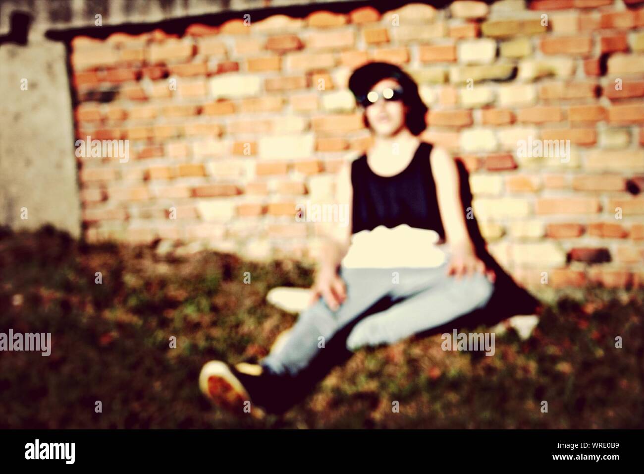 Woman Sitting Leaning Against Wall High Resolution Stock Photography ...