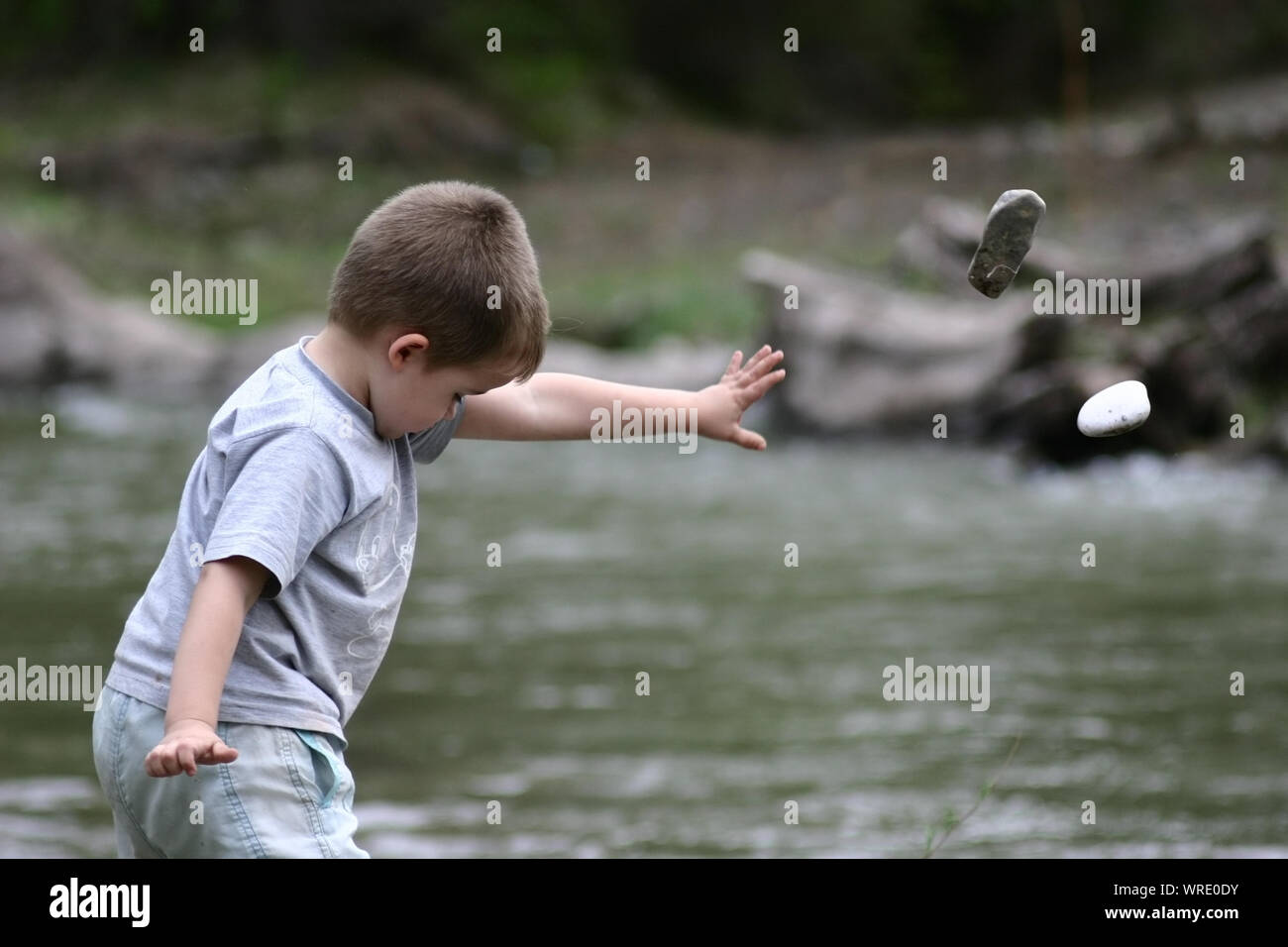 Boy throws stones hi-res stock photography and images - Alamy