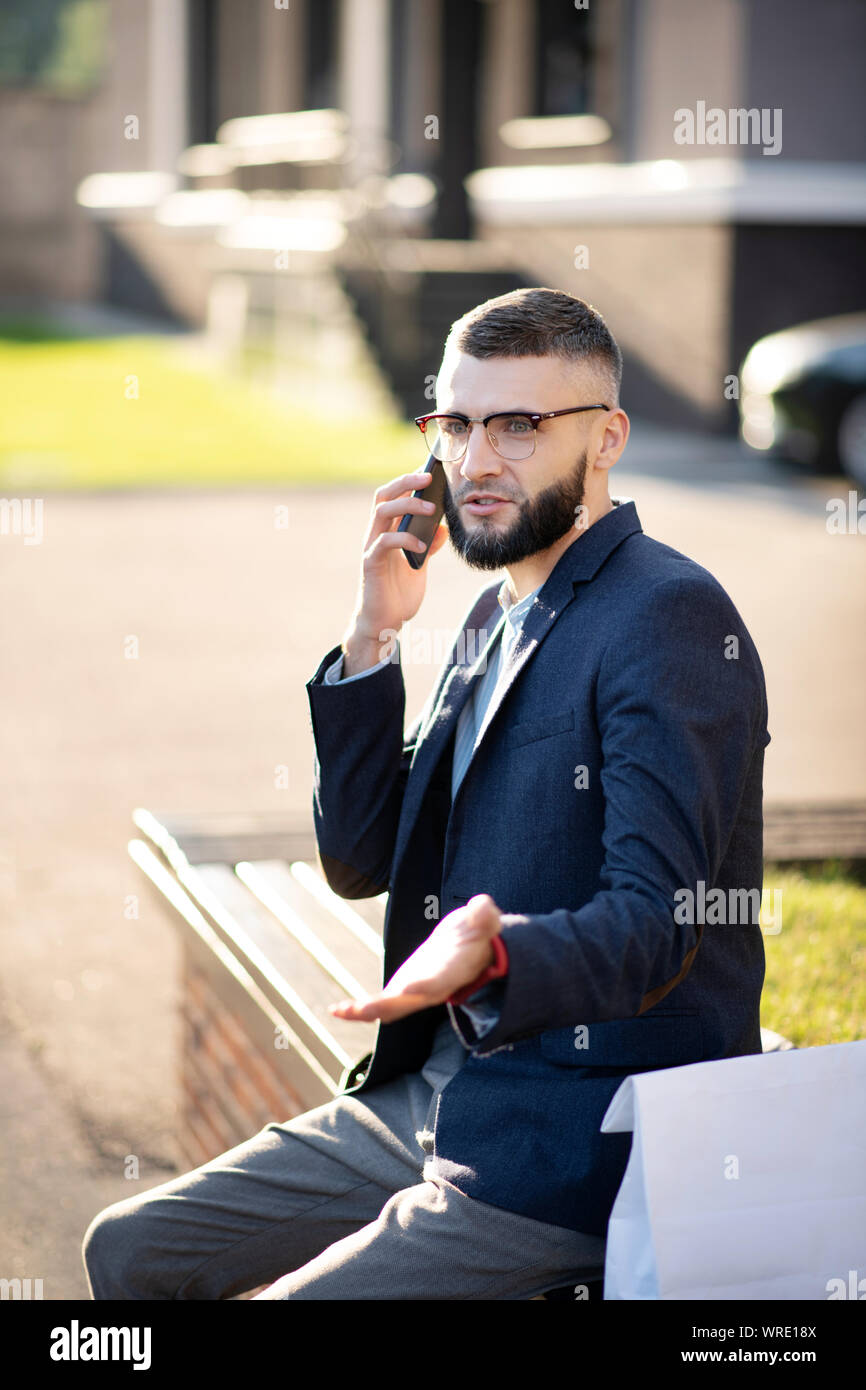 Businessman speaking colleague hi-res stock photography and images - Alamy