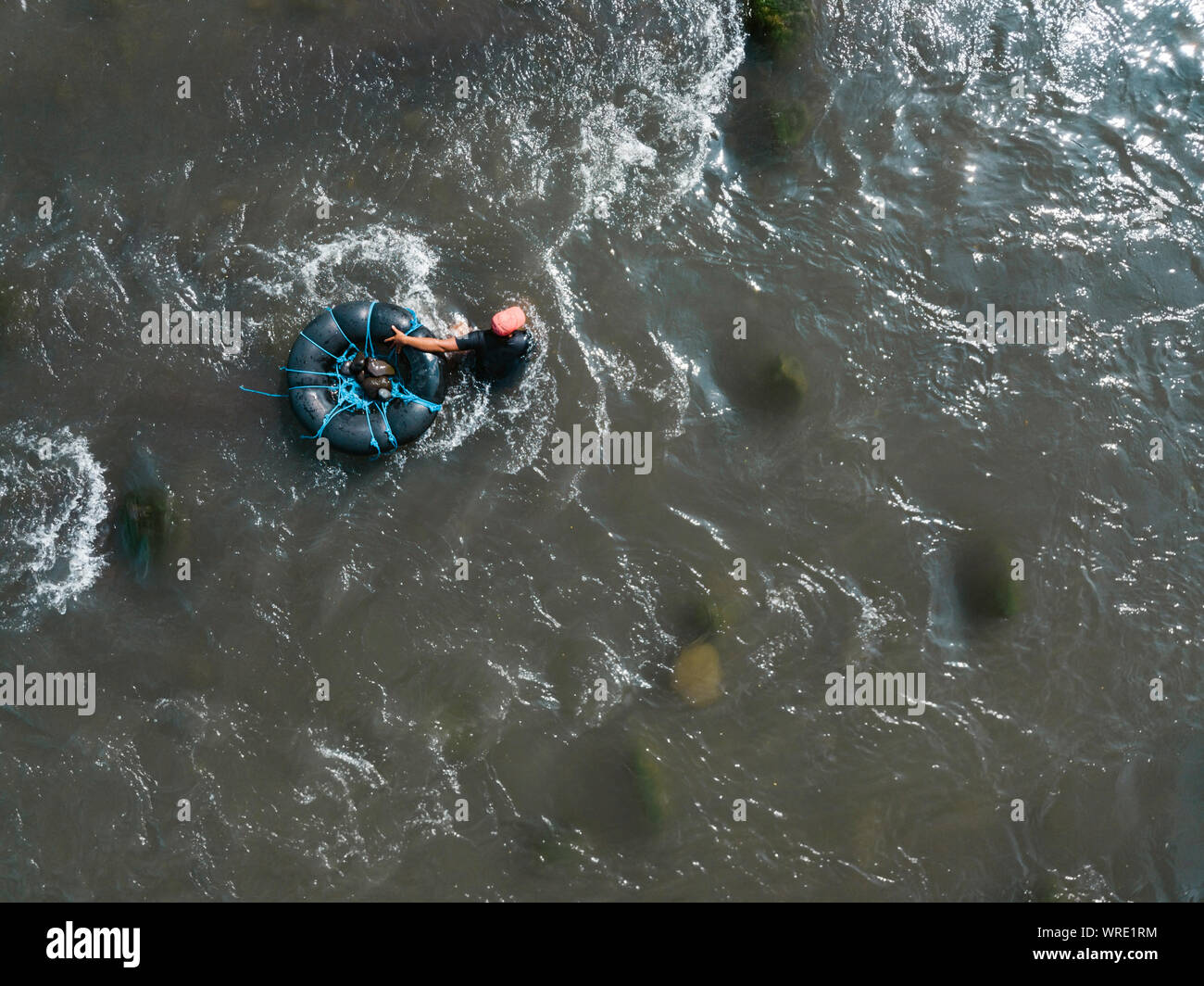 Aerial view of man in river Stock Photo - Alamy