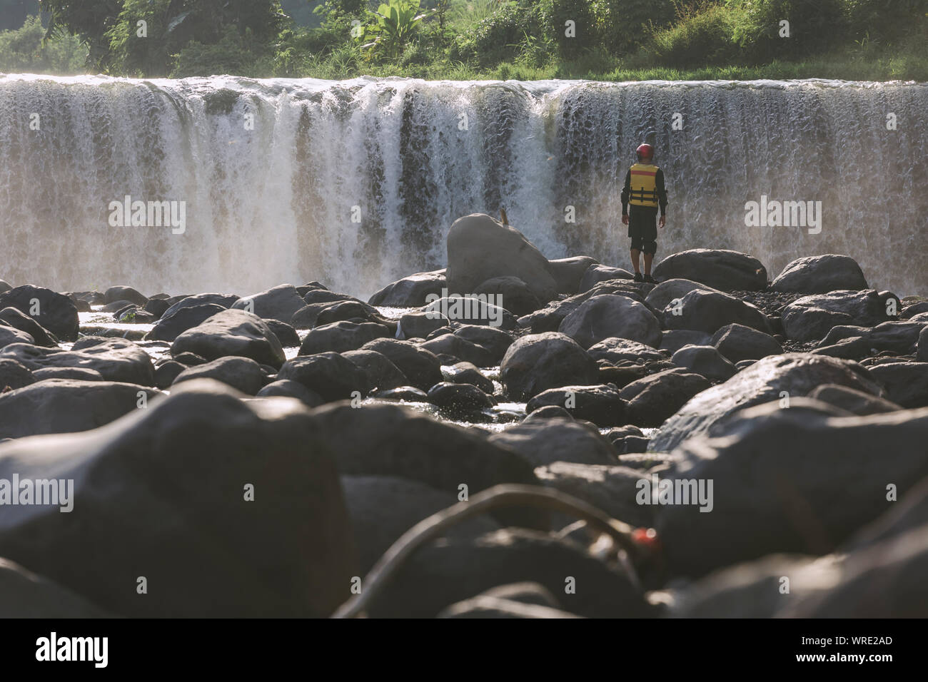 Man near waterfall Stock Photo - Alamy