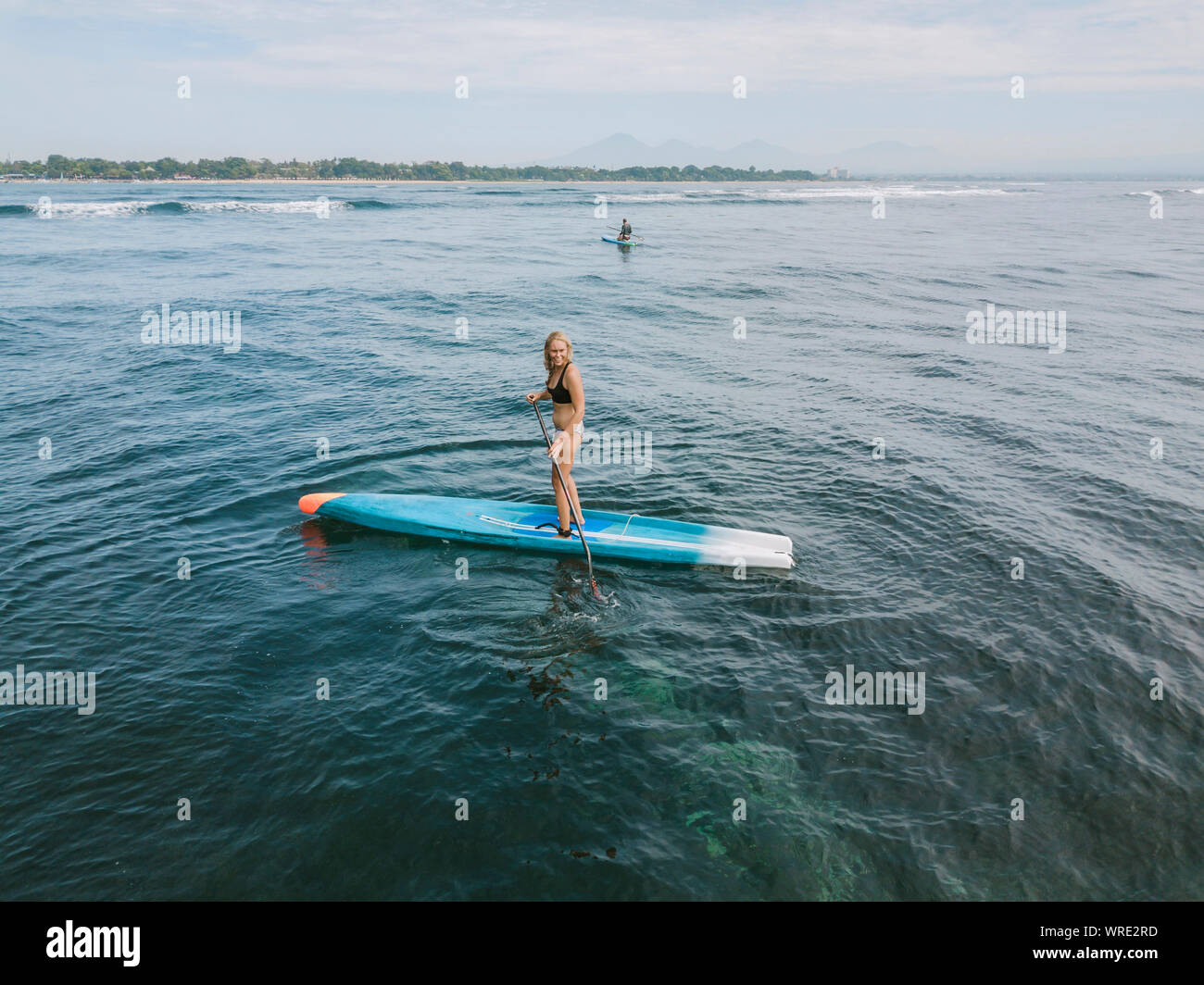 Aerial view of sup surfers Stock Photo - Alamy
