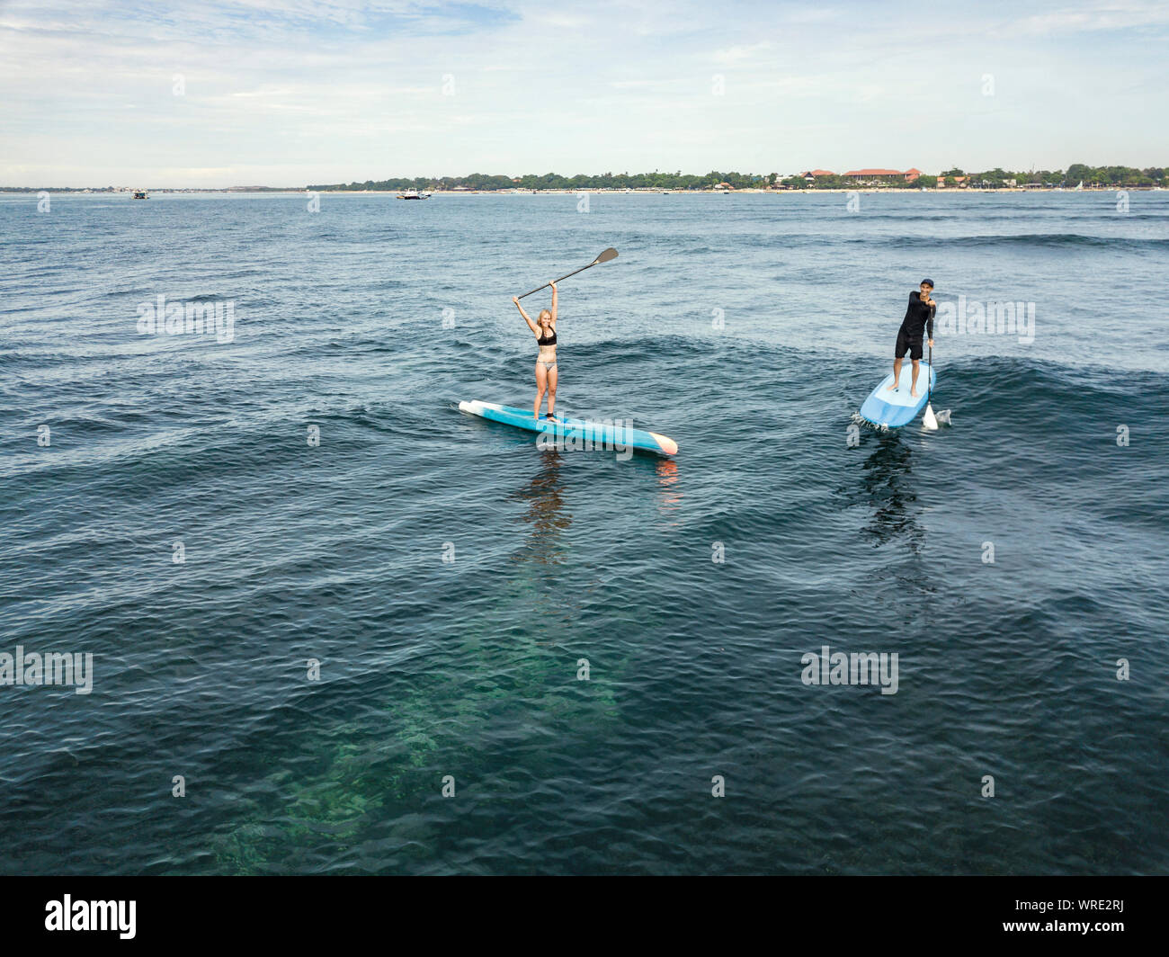 Aerial view of sup surfers Stock Photo - Alamy