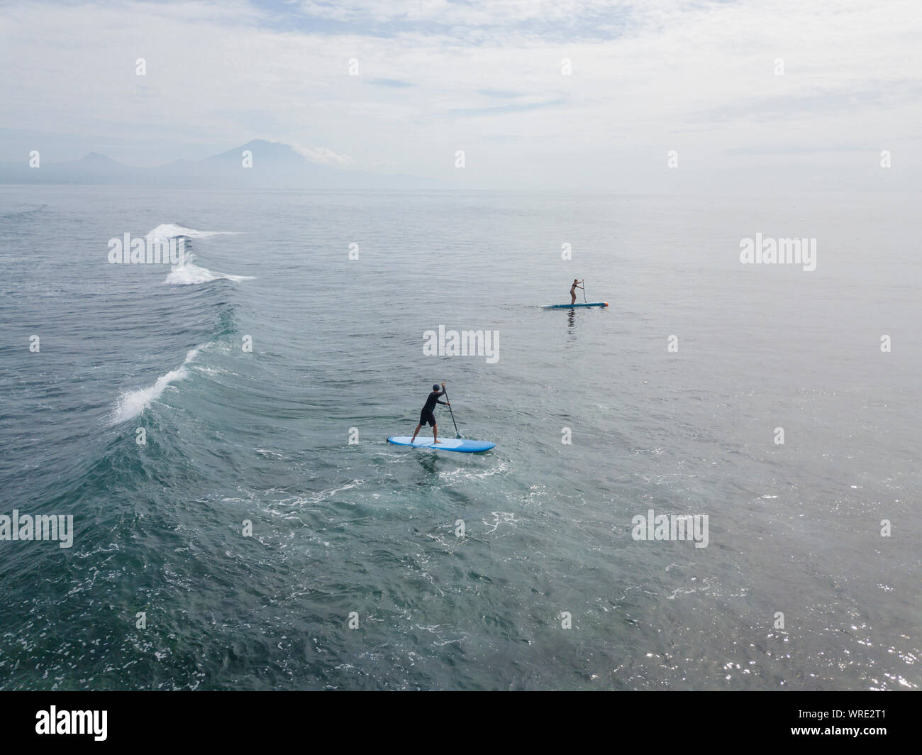 Aerial view of sup surfers Stock Photo - Alamy