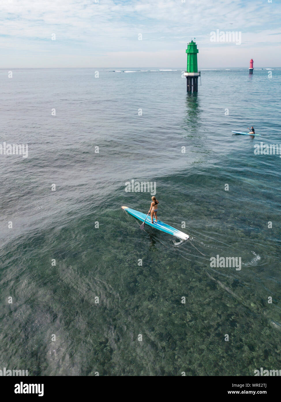 Aerial view of sup surfers Stock Photo - Alamy
