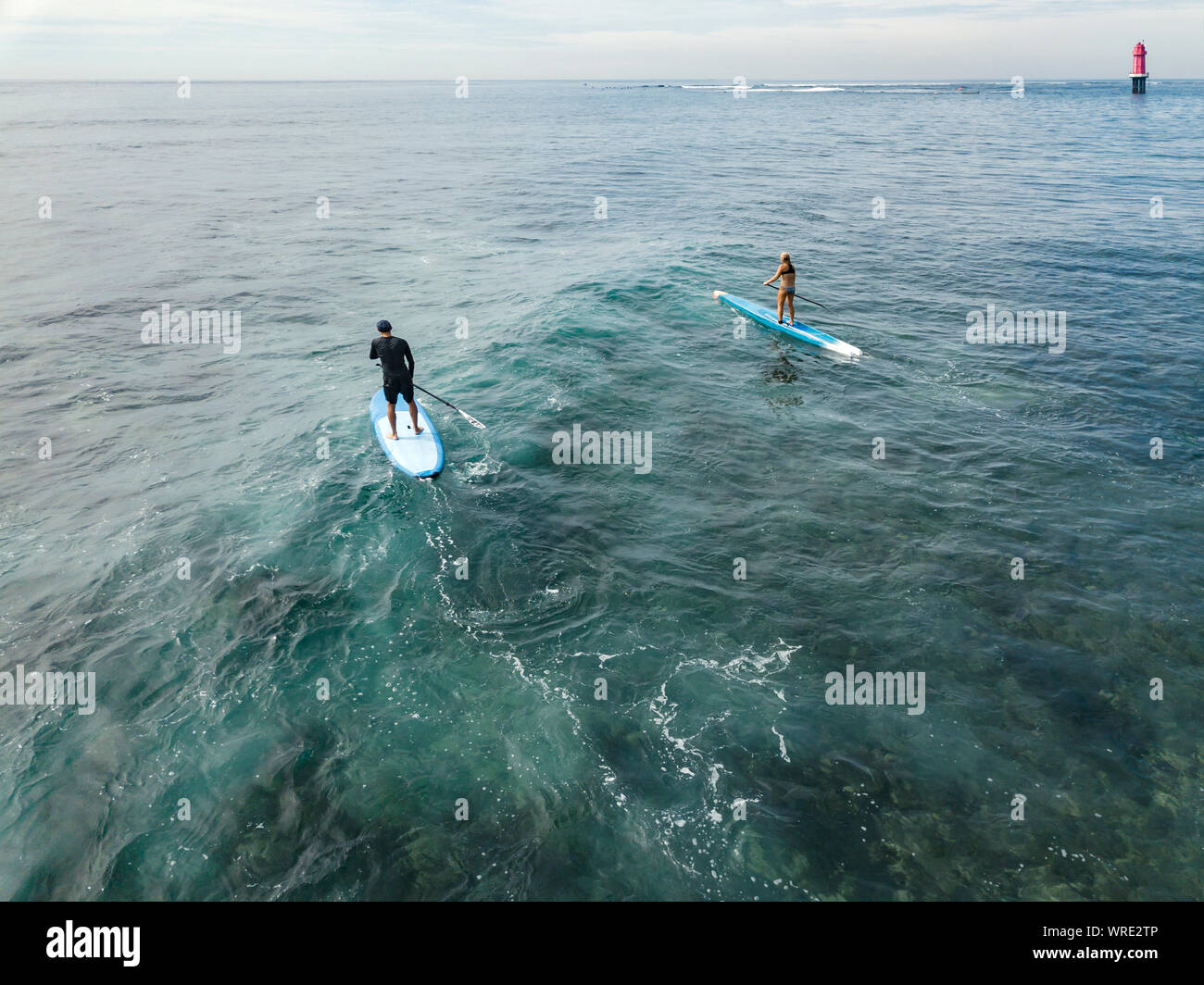 Aerial view of sup surfers Stock Photo - Alamy