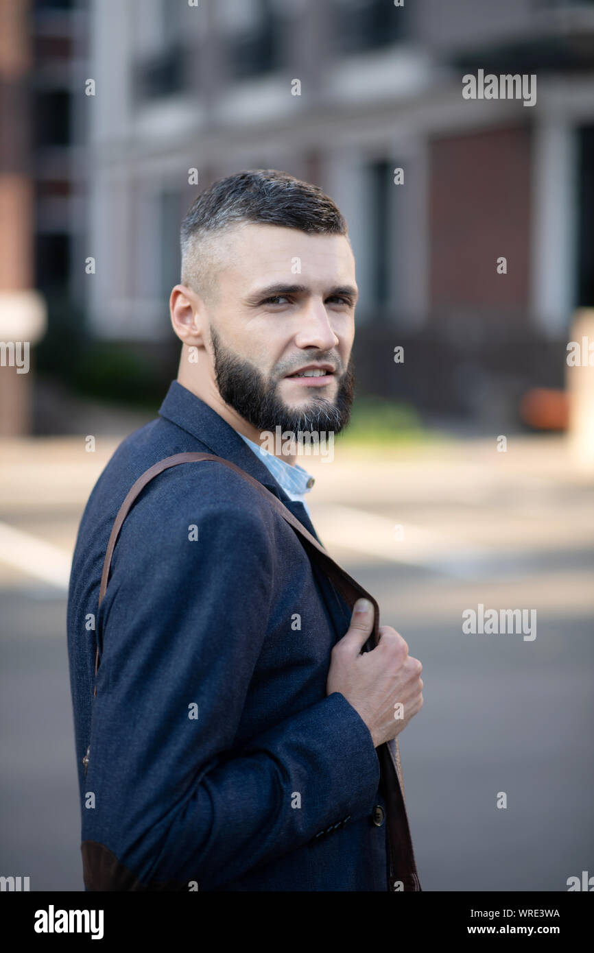 Successful businessman wearing dark jacket standing outside Stock Photo ...