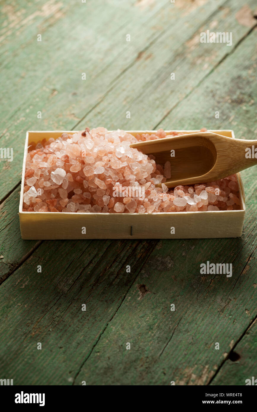 Himalayan salt on a wood table Stock Photo - Alamy