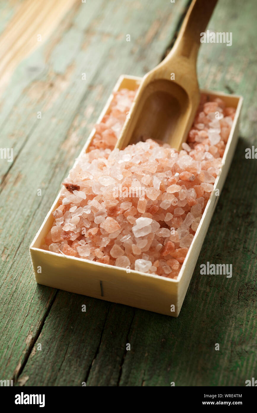 Himalayan salt on a wood table Stock Photo - Alamy
