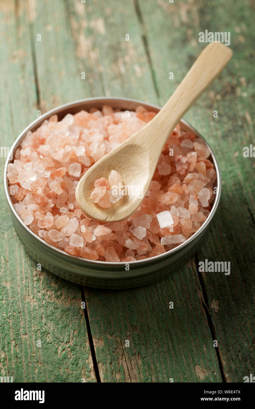 Himalayan salt on a wood table Stock Photo - Alamy