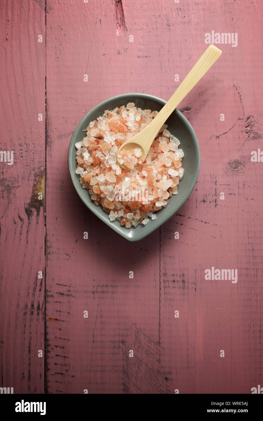 Himalayan salt on a wood table Stock Photo - Alamy