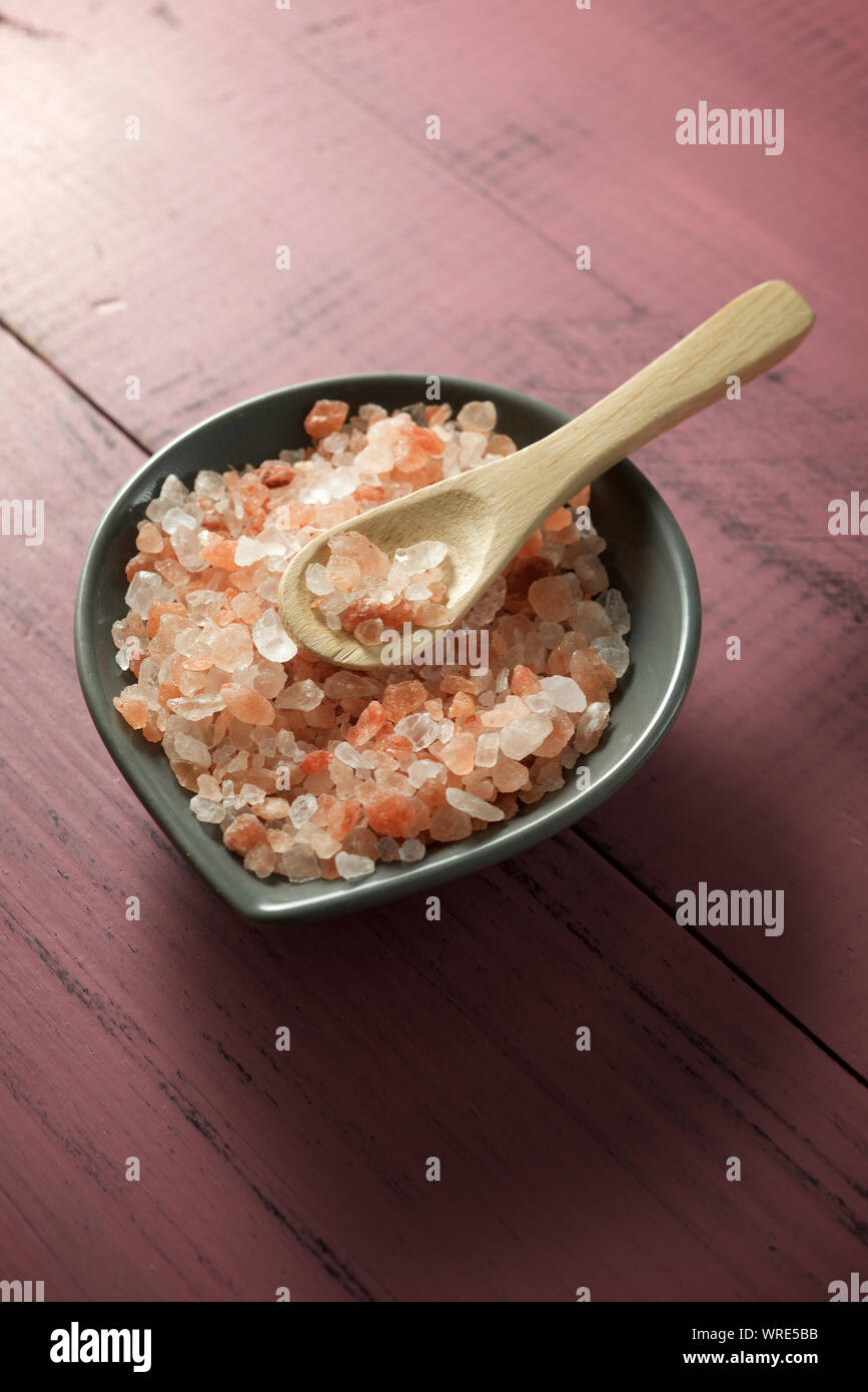 Himalayan salt on a wood table Stock Photo - Alamy