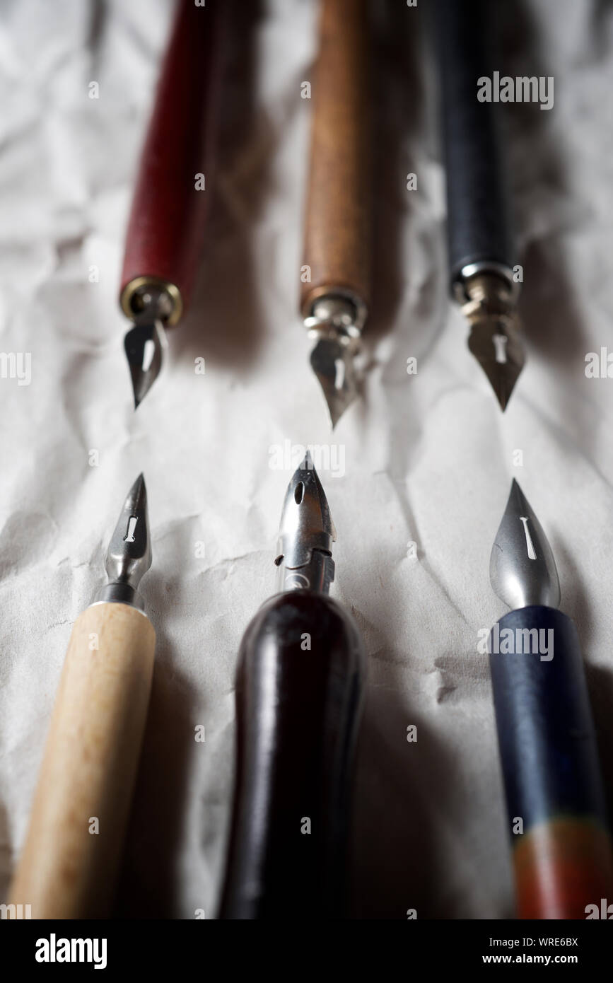 Nib pens on a white paper Stock Photo - Alamy