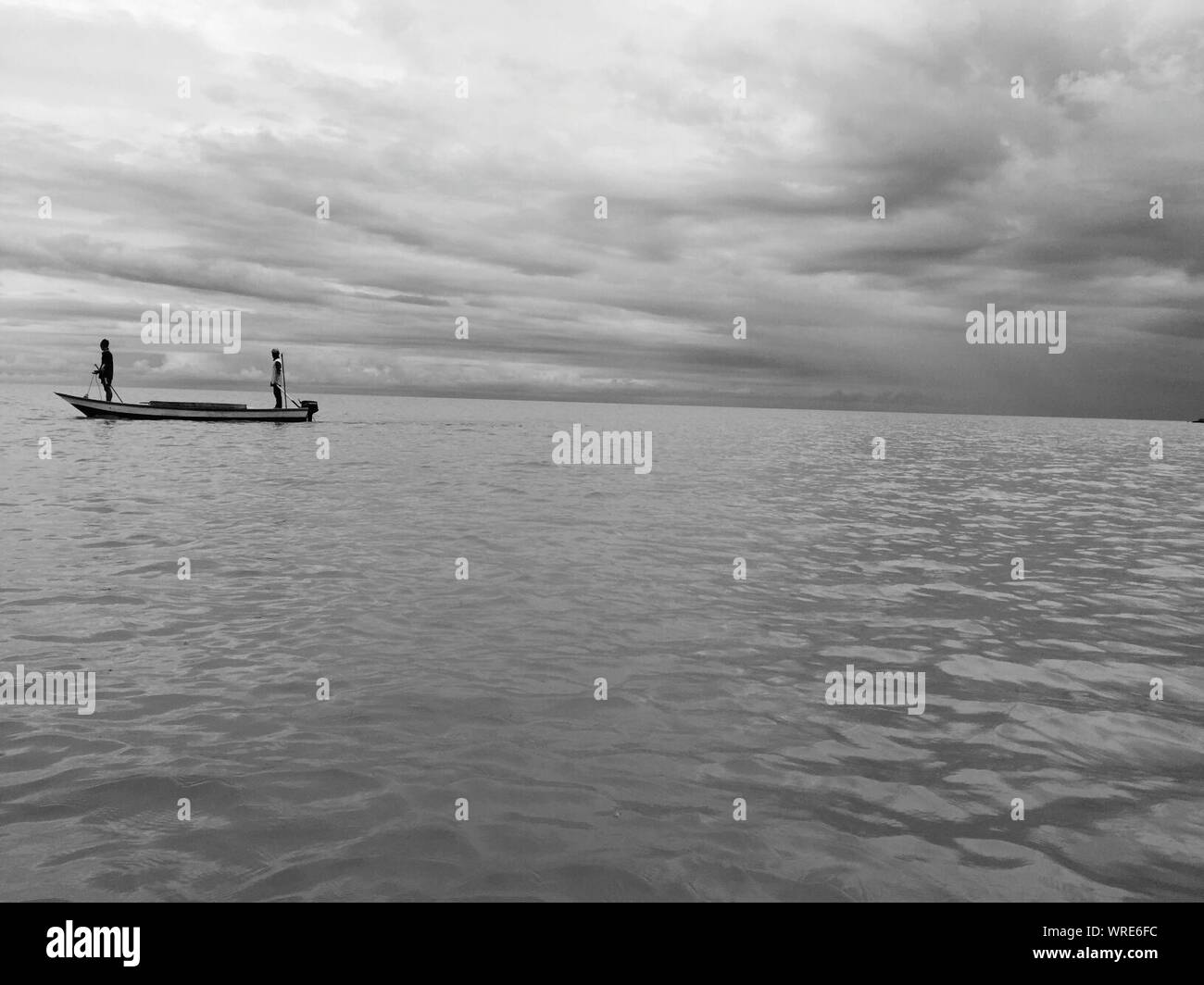 Two men in rowboat hi-res stock photography and images - Alamy