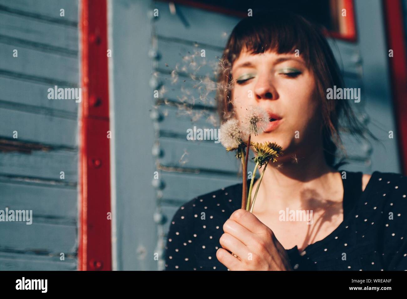 Mouth blowing hi-res stock photography and images - Alamy