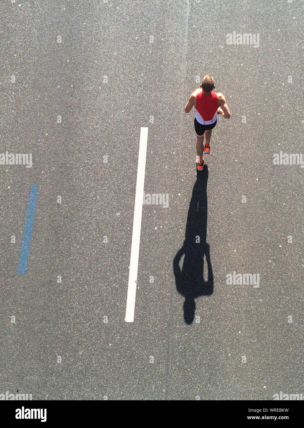 Shadow man running on street hi-res stock photography and images - Alamy