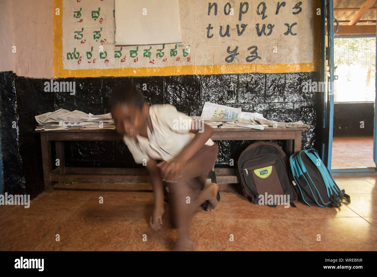 A playful tribal child in his school's classroom Stock Photo - Alamy