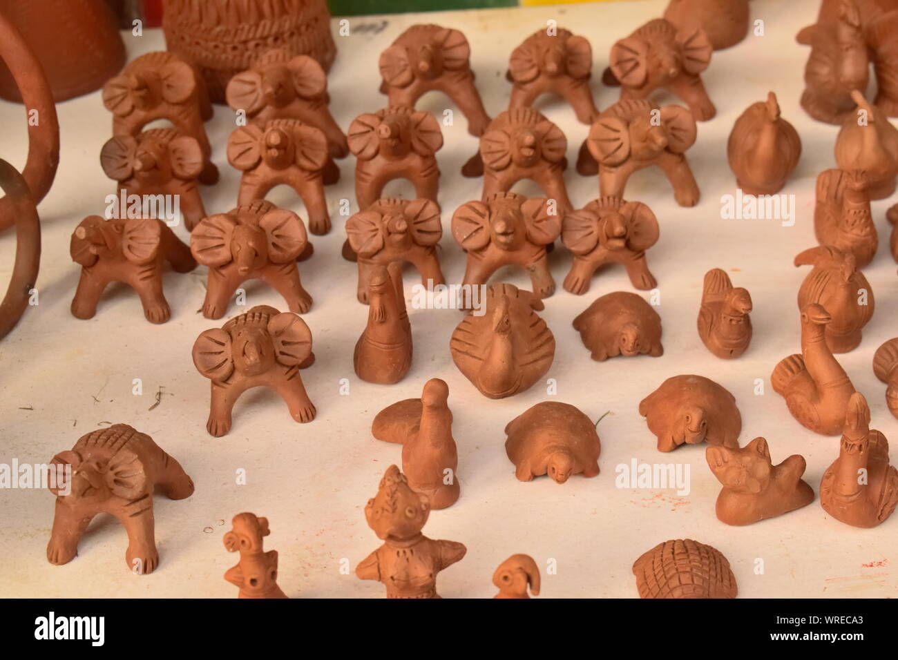 clay made miniature of different animals like elephant duck and dolls ...