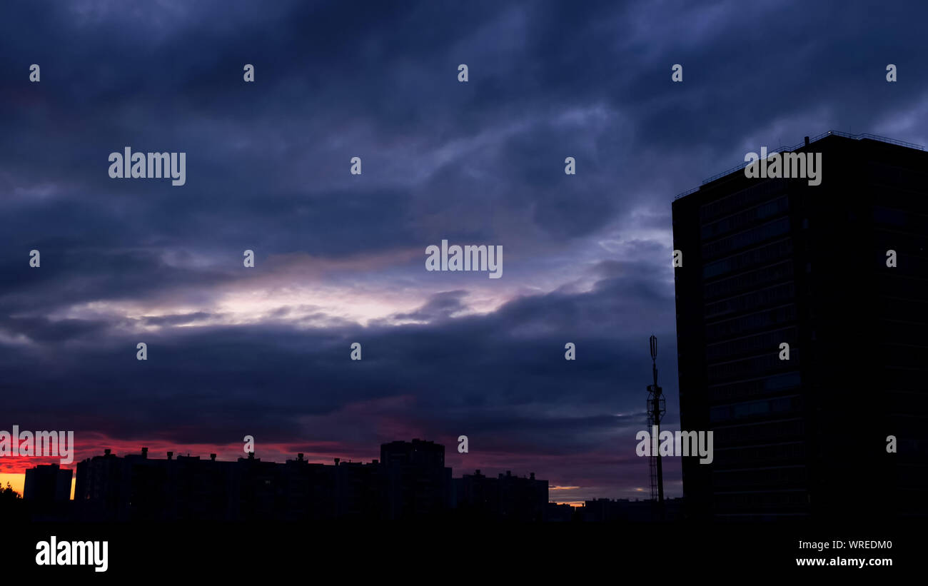 Day to night skyline cityscape, dark, sunset Stock Photo - Alamy