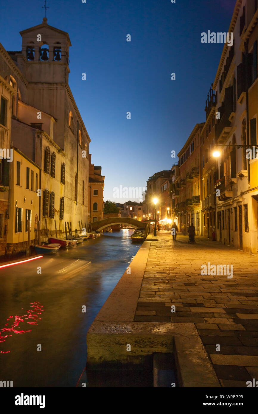 Night light old venice street with bridge and church tower Stock Photo ...