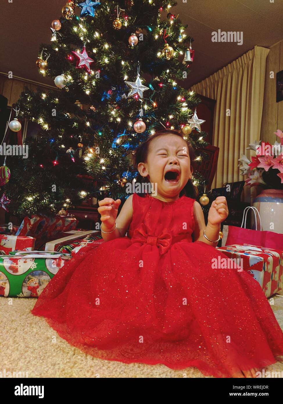 Child crying christmas tree hi-res stock photography and images - Alamy