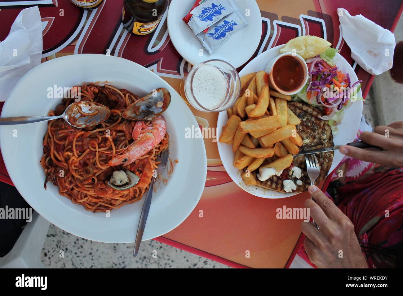 Seafood Lunch at the Seafront Cafe, Armier Bay, Malta Stock Photo - Alamy