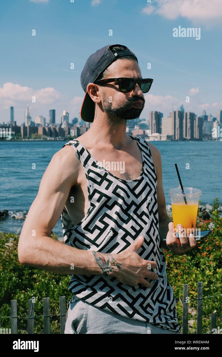 Standing man drinking hi-res stock photography and images - Alamy